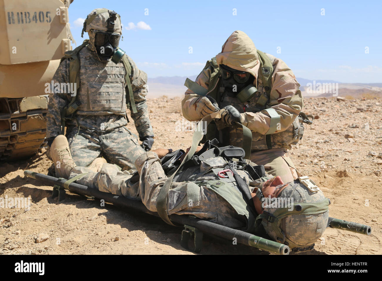 U.S. Army Soldiers from 4th Battalion, 6th Infantry Regiment, strap a ...