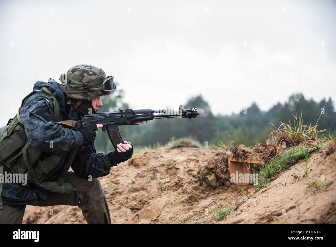 A Ukrainian National Guard soldier provides security during exercise ...