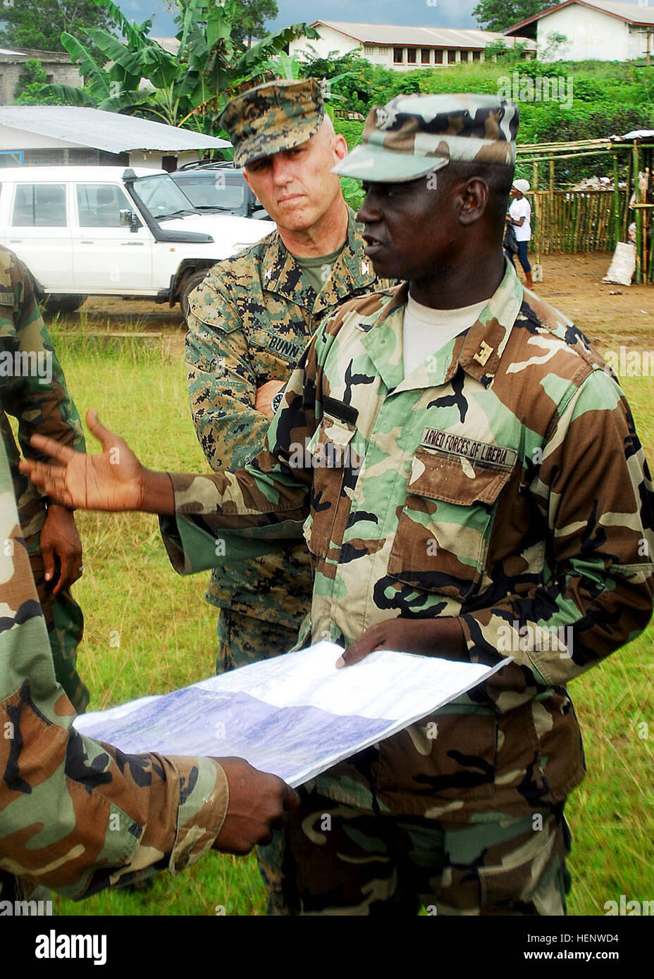 A Liberian engineer platoon commander briefs commanders on the ...