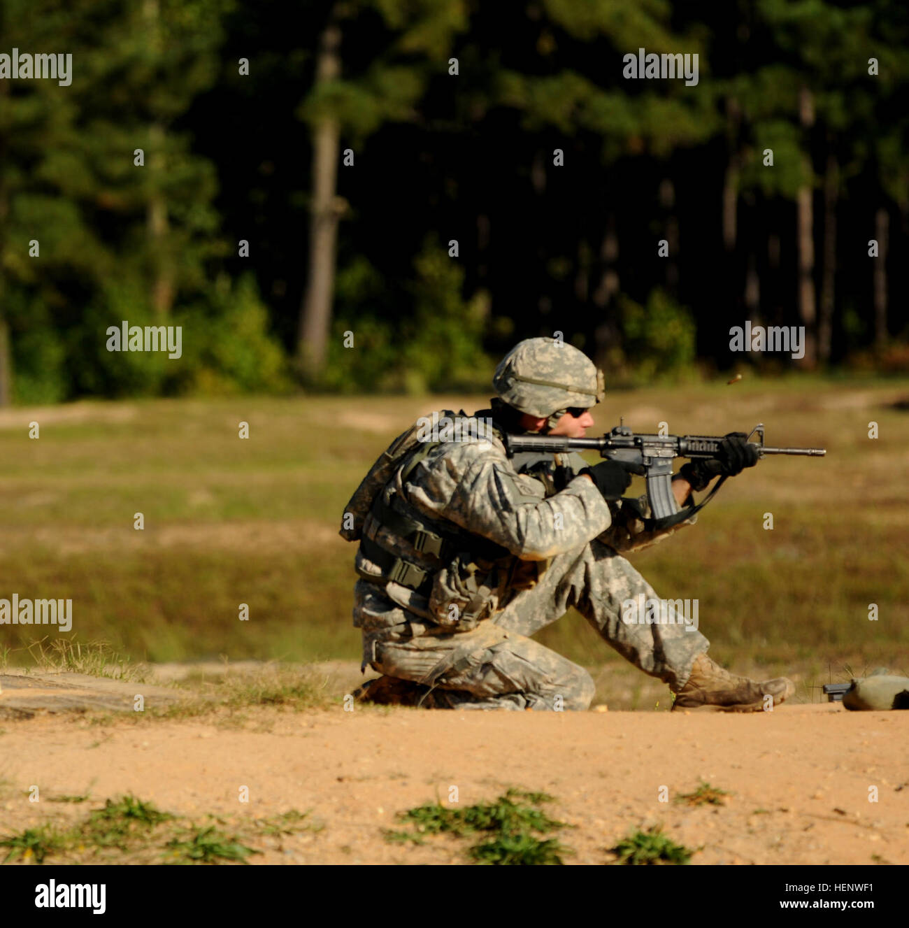 A medic from the 82nd Airborne Division fires his M4 Carbine Rifle ...