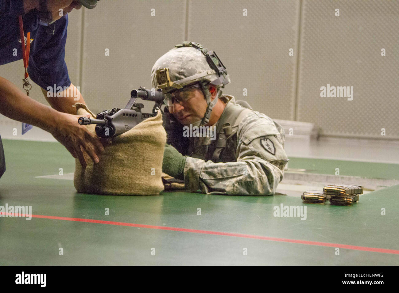 A Tropic Lightning Soldier receives instructions and help prior to ...
