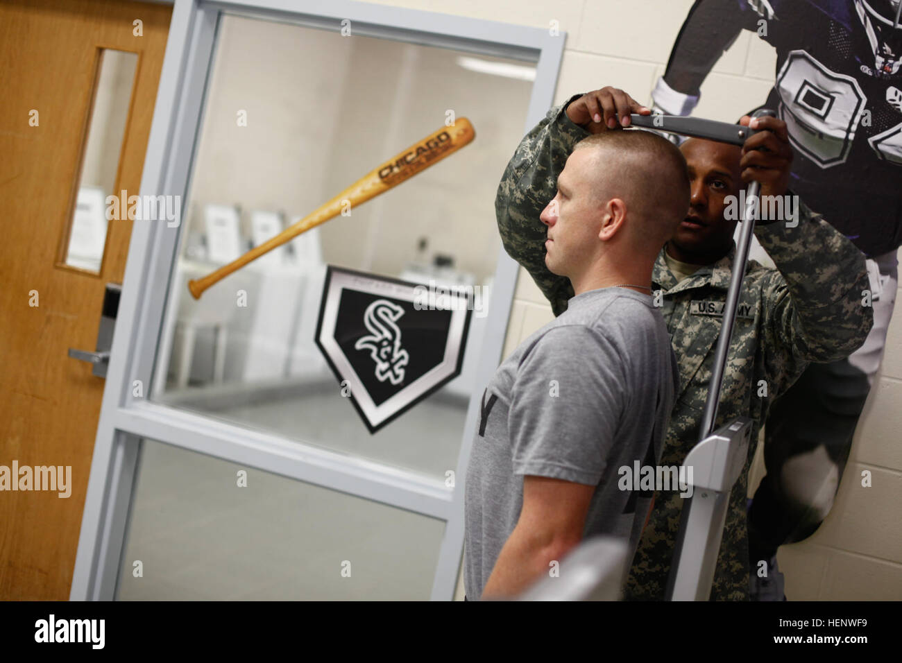 U.S. Army Staff Sgt. Kevin Hopson, starts the height, weight and tape ...
