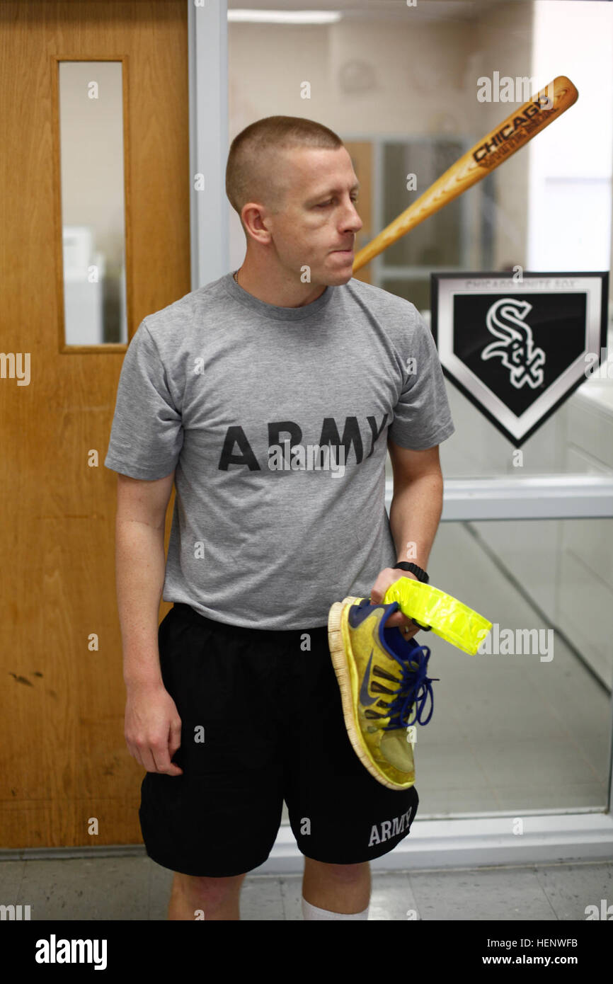 U.S. Army Staff Sgt. Kevin Hopson starts the height, weight and tape ...