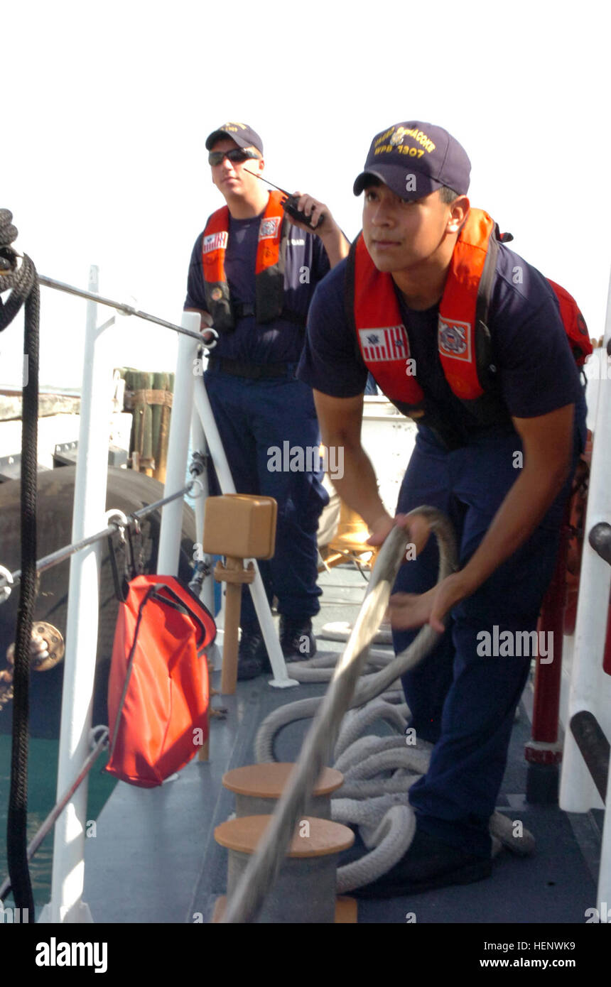 GUANTANAMO BAY, Cuba – Coast Guard Seaman Robert Navejar reels in a ...