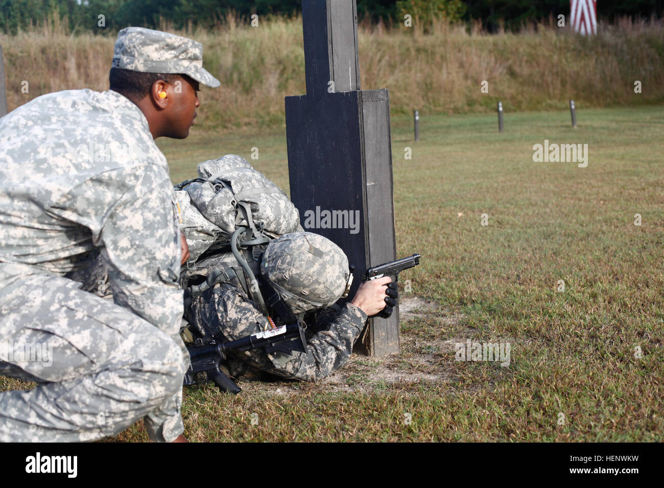 U.S. Army Staff Sgt. Luke Klein shoots a M9 pistol at targets during ...