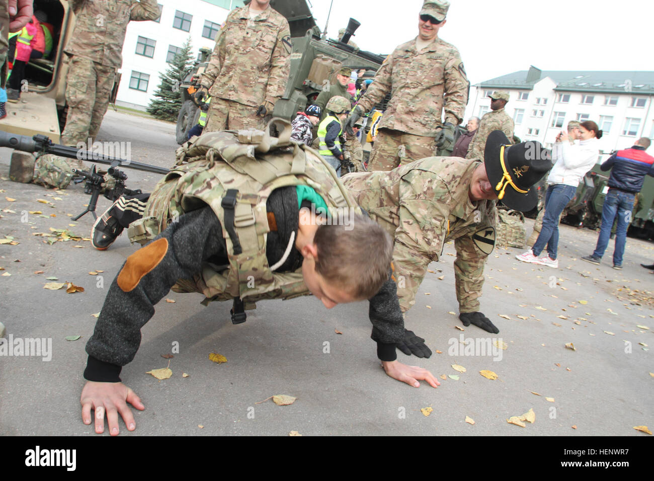 A Lithuanian student does push-ups in U.S. ballistic body armor Oct. 8 ...