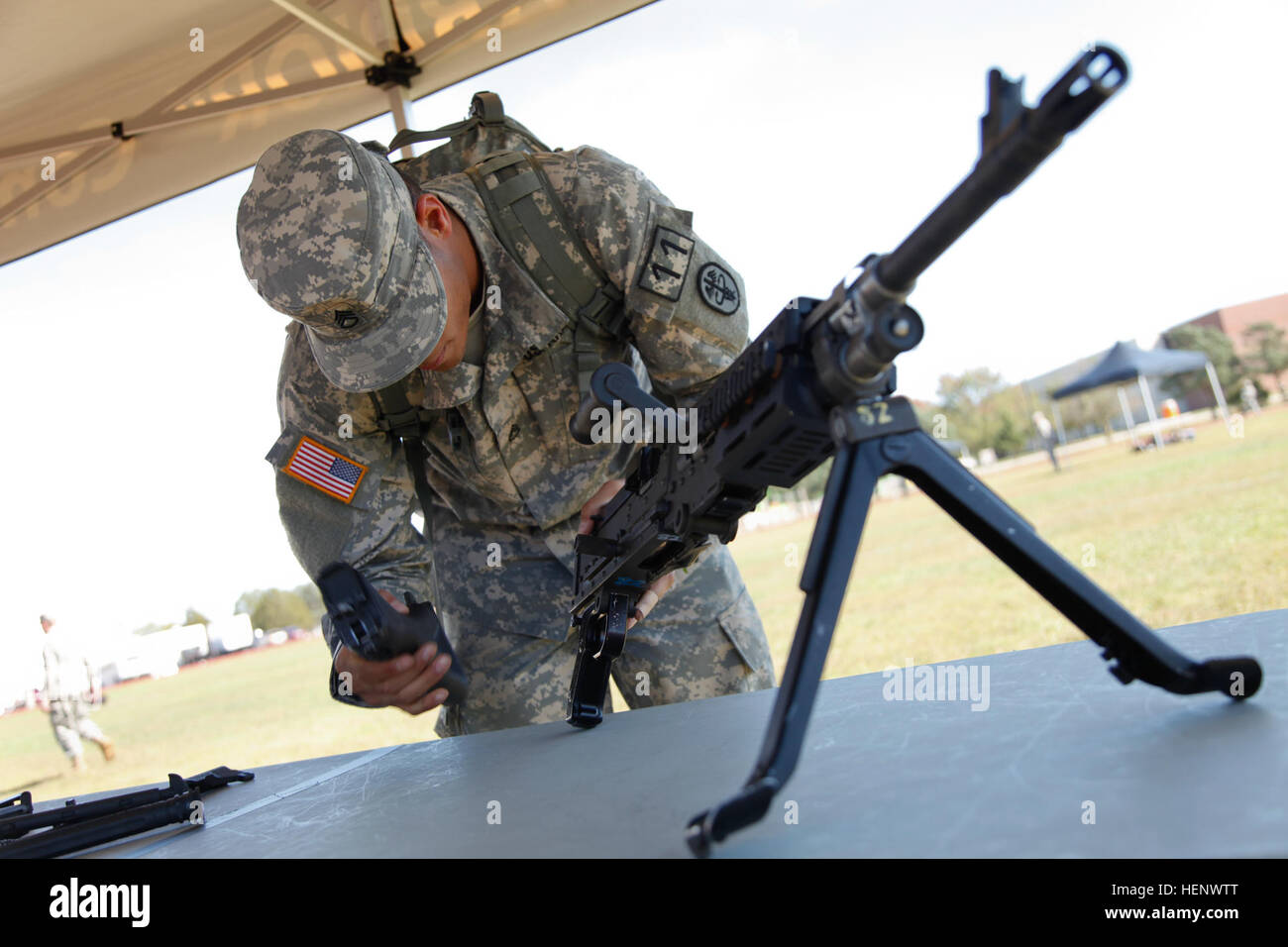 U.S. Army Staff Sgt. Victor Munoz begins the weapons assembly event ...