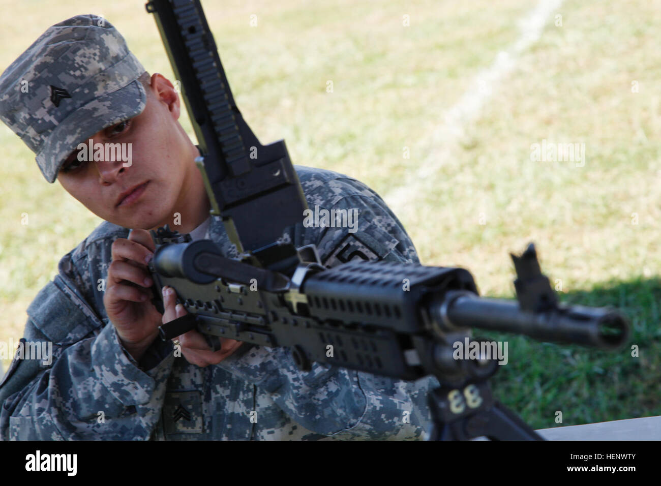 U.S. Army Sgt. Andres Martinez begins the weapons assembly event during ...