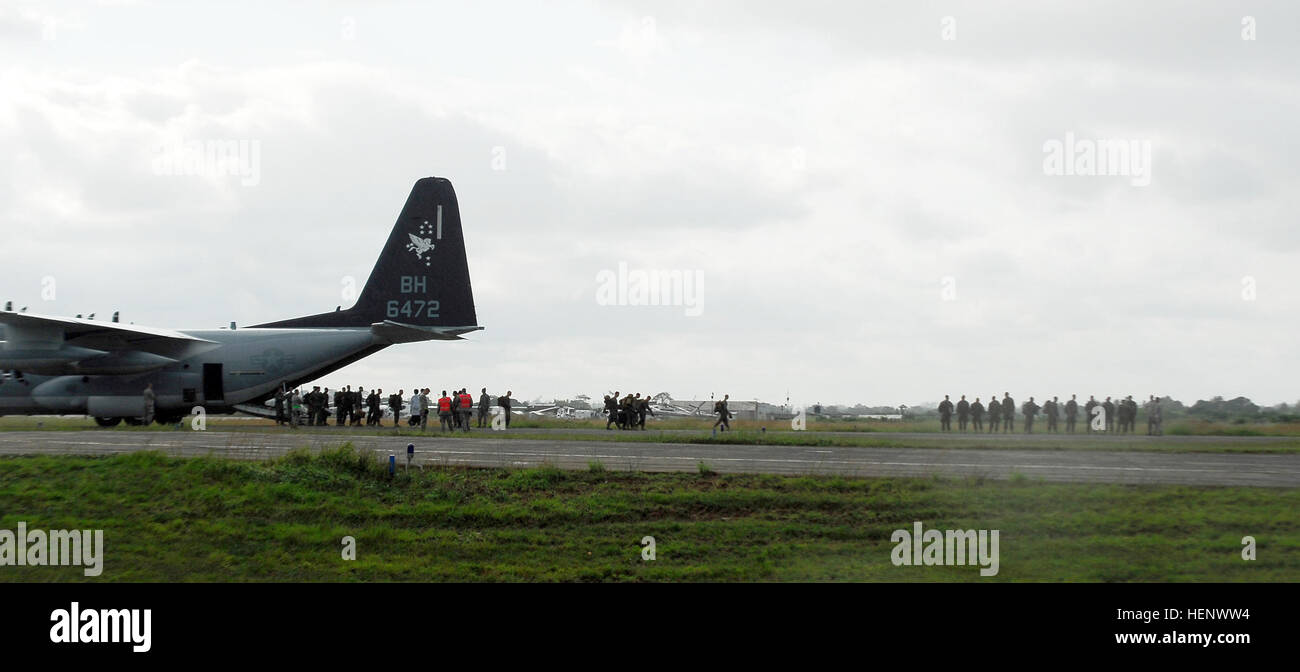 A KC-130 Hercules stands open as Marines from the Special Purpose ...
