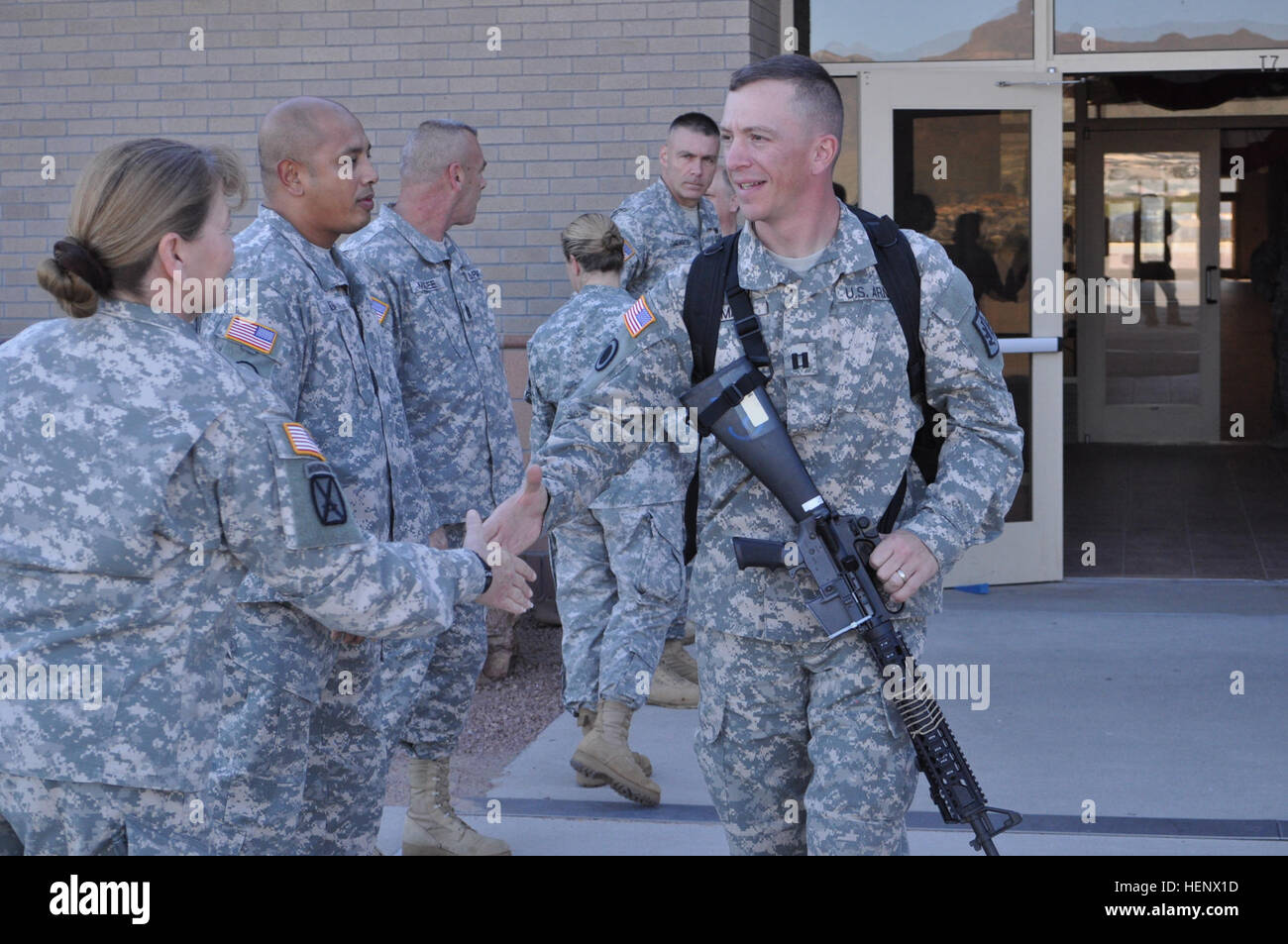 Capt. John Smith, right, commander, 361st Military Police Company, says ...