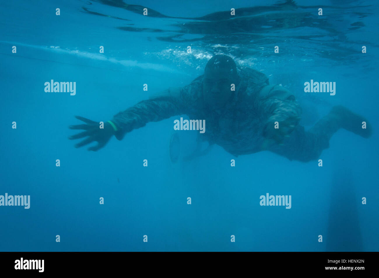A soldier assigned to the 7th Special Forces Group (Airborne) swims 50 ...