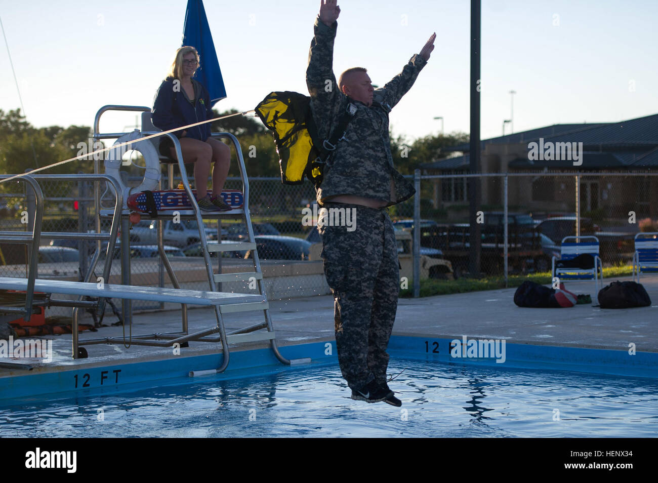 A soldier assigned to the 7th Special Forces Group (Airborne) jumps ...