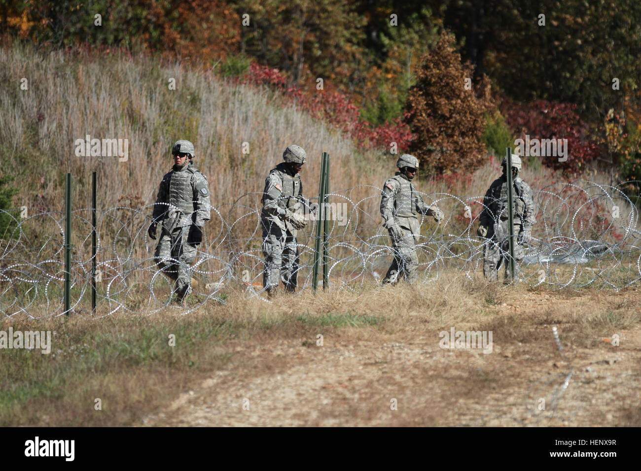 Soldiers set up concertina wire obstacles during the October Sapper ...