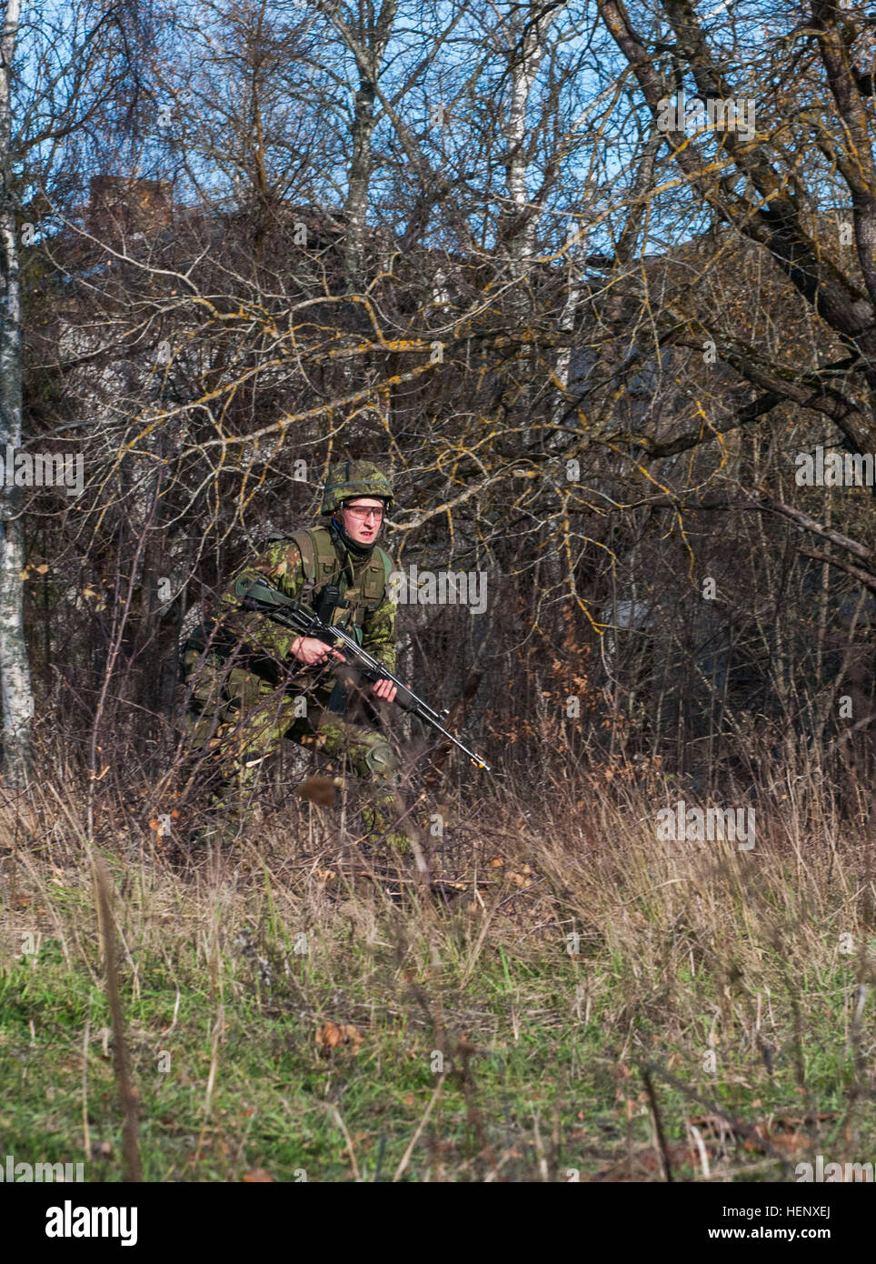 An Estonian Soldier maneuvers to a defensive fighting position during a ...