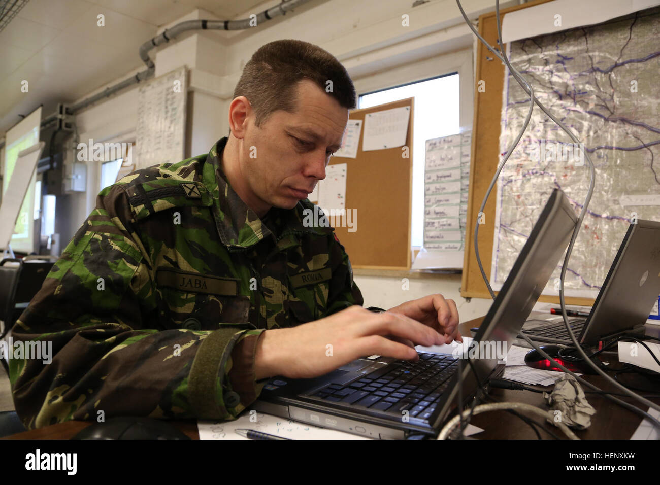A Romanian soldier from a mounted battalion prepares a mission brief ...
