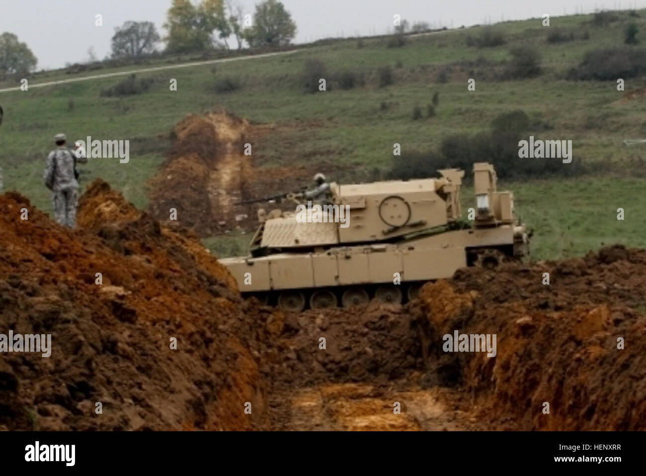 After creating a path using Assault Breaching vehicles, Soldiers with ...