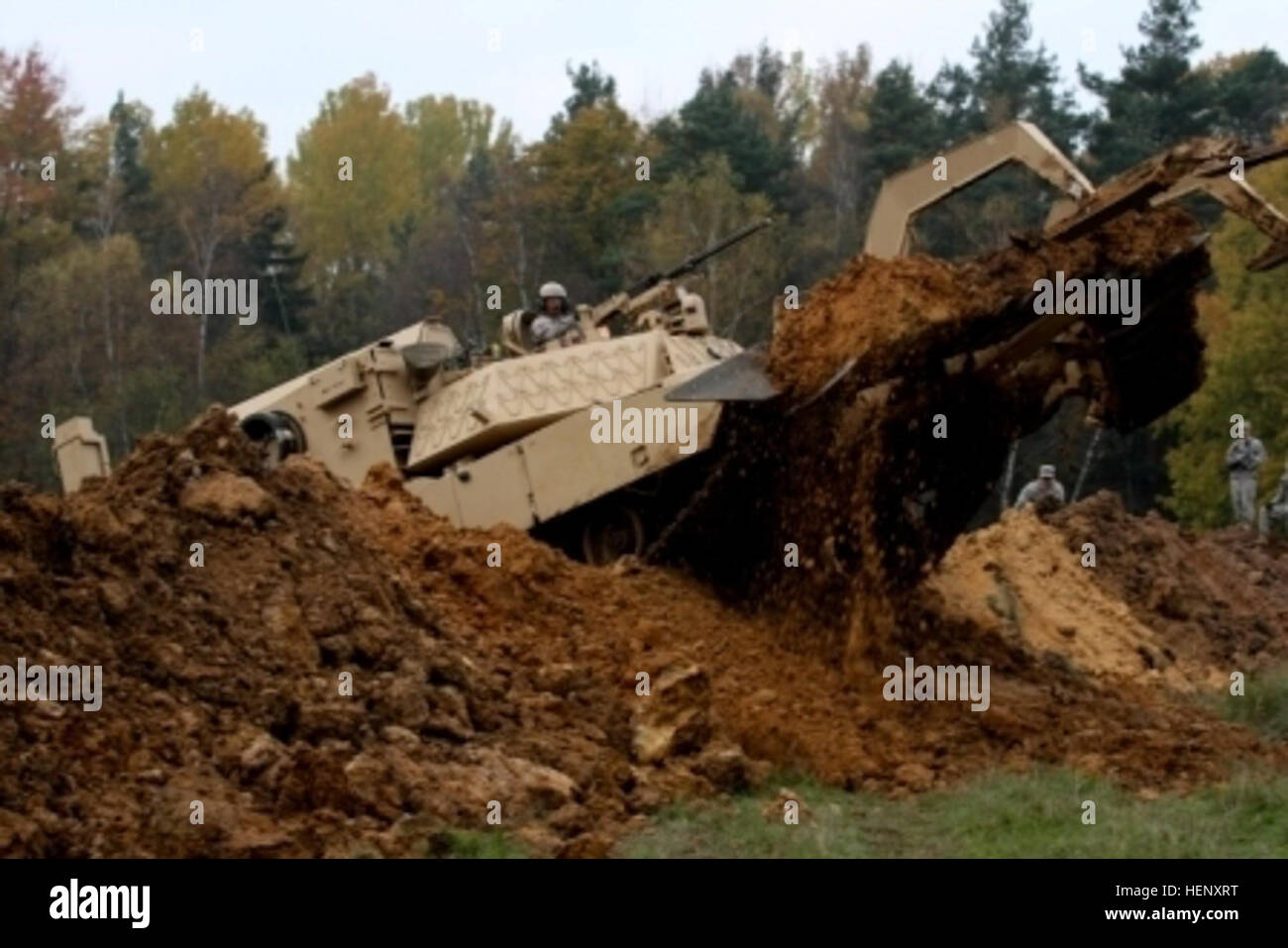 After creating a path using Assault Breaching vehicles, Soldiers with ...