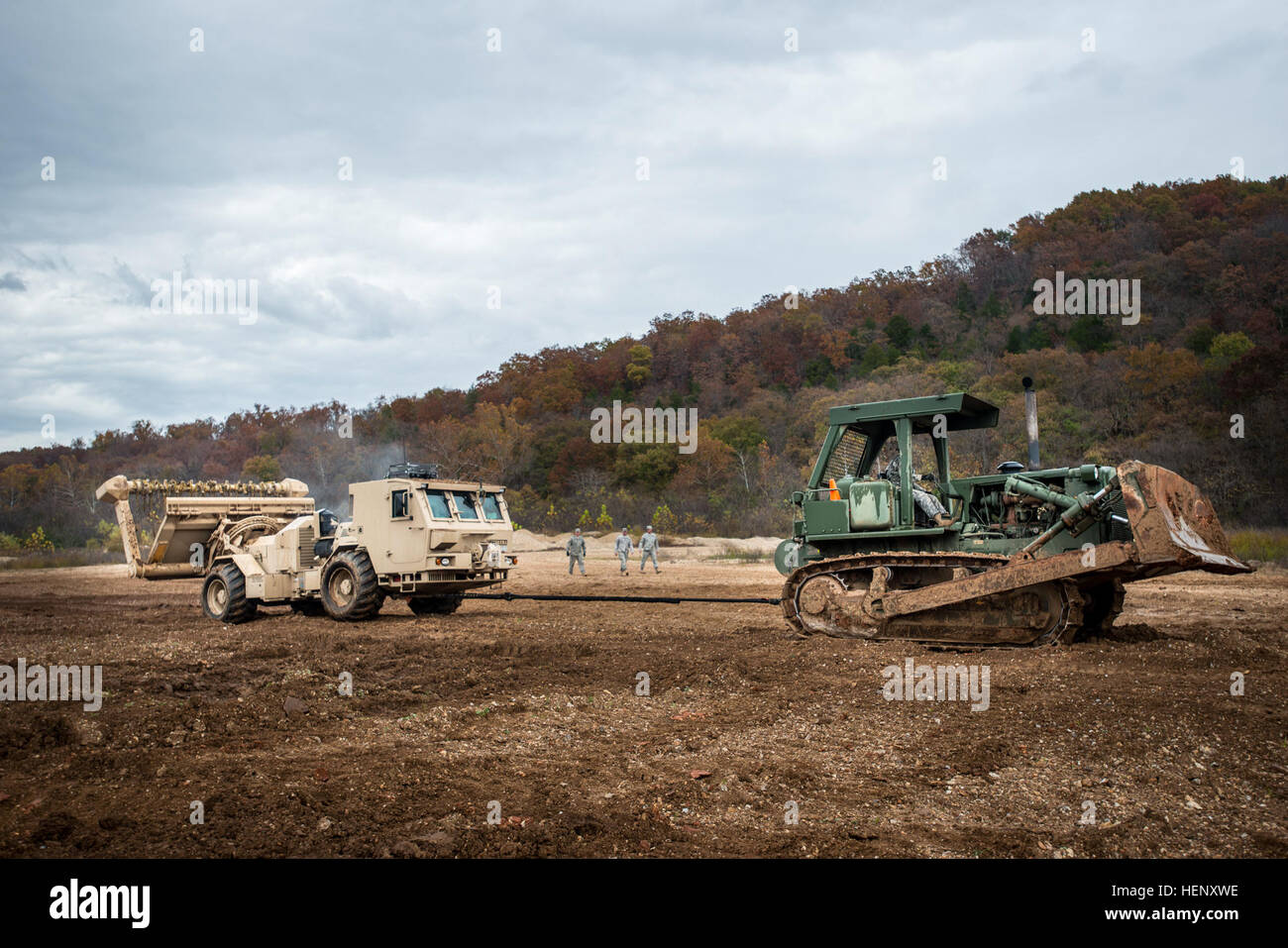 An Army bulldozer tows the M1271 Mine Clearing Vehicle during the ...