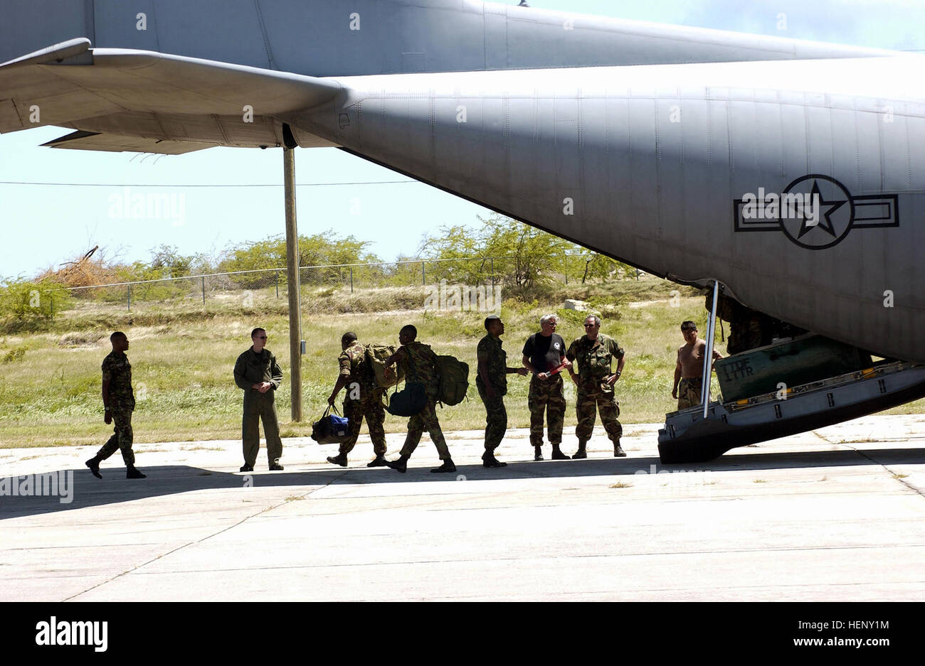 Trinidad and Tobago Defence Force personnel unload a C-130 cargo ...