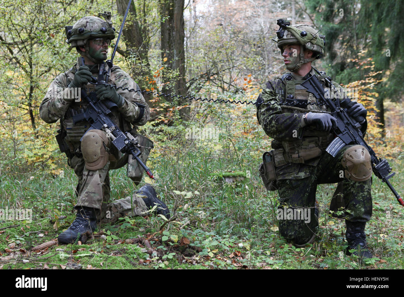 Danish soldiers exchange information while conducting zone ...