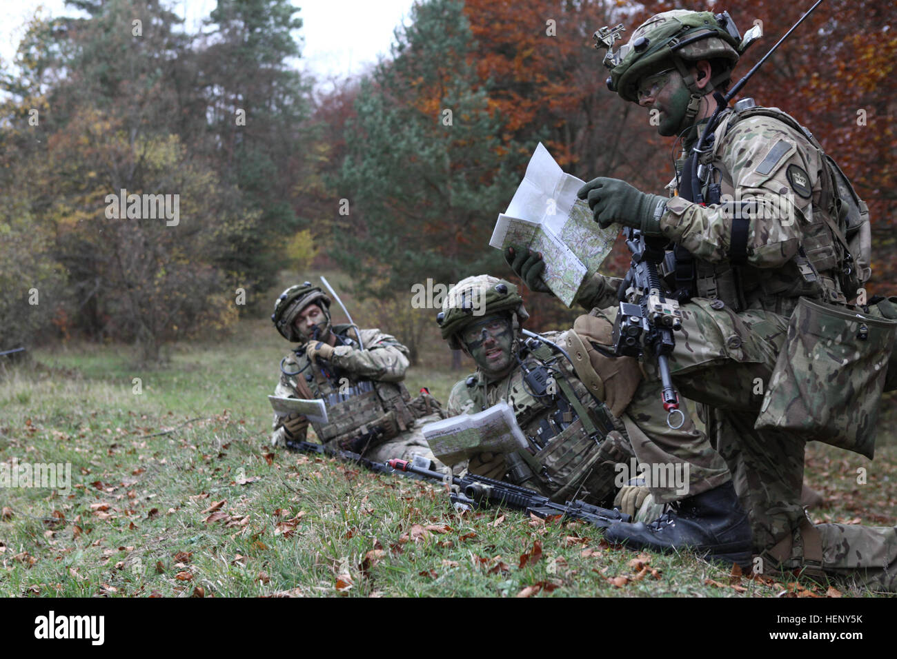 Danish soldiers review the map while conducting zone reconnaissance ...