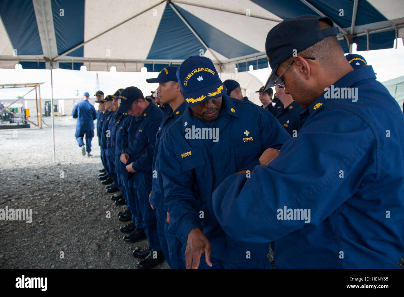 Officers from the U.S. Public Health Service straighten up their ...