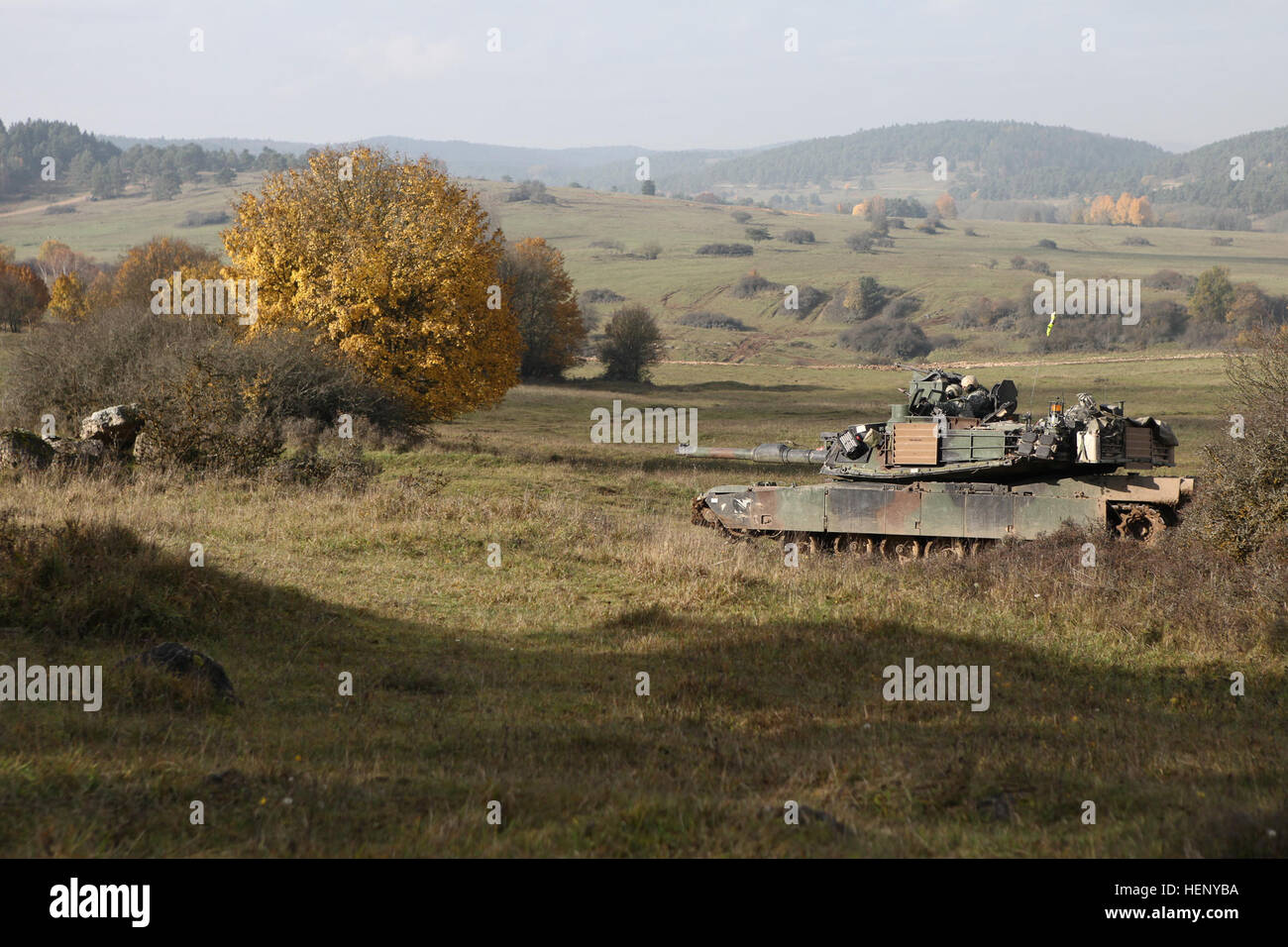 U.S. Soldiers in a M1A2 Abrams tank maneuvers towards the objective ...