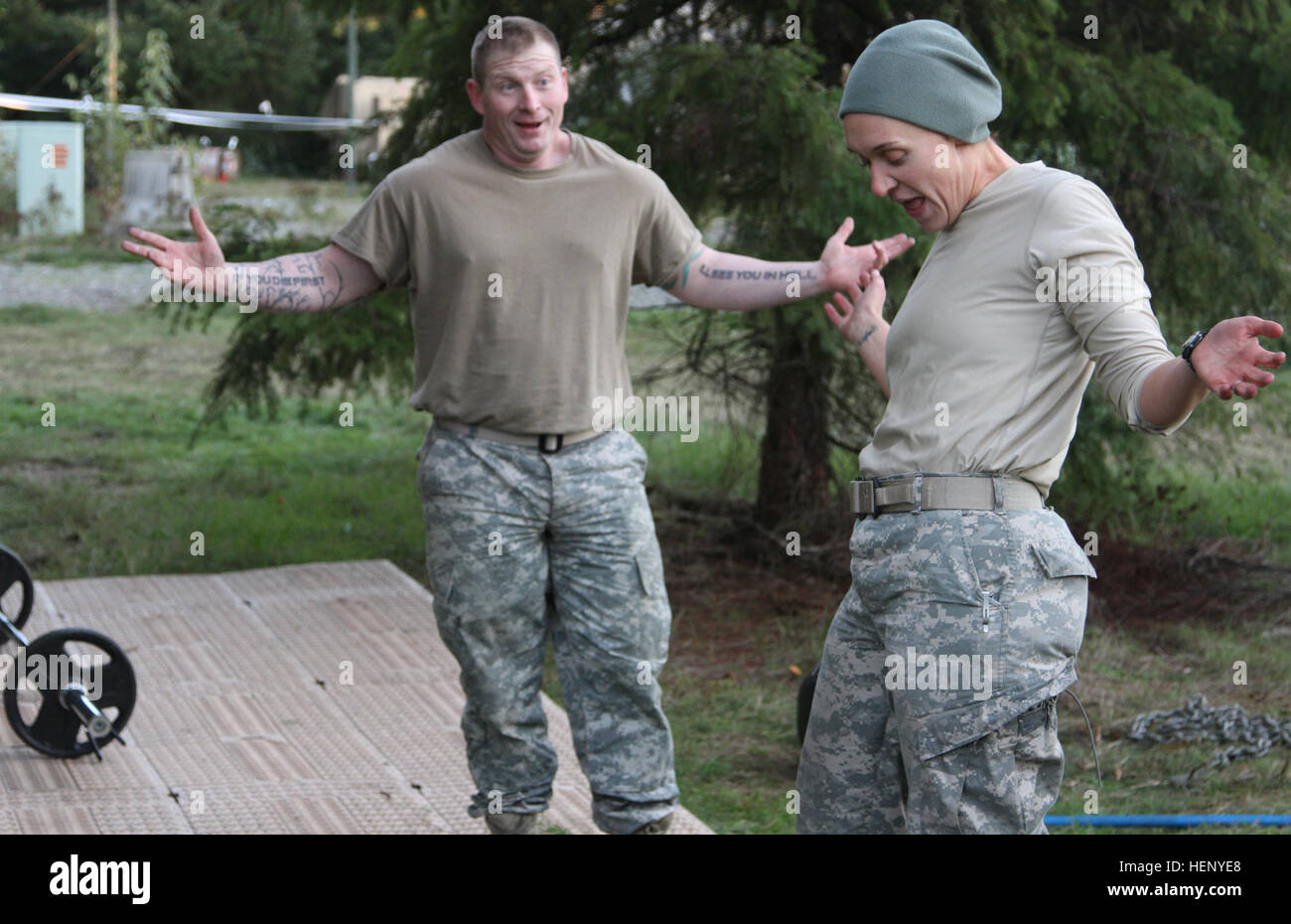 Sgt. Erin L. McKee (front) mentally prepares for a grueling workout by ...