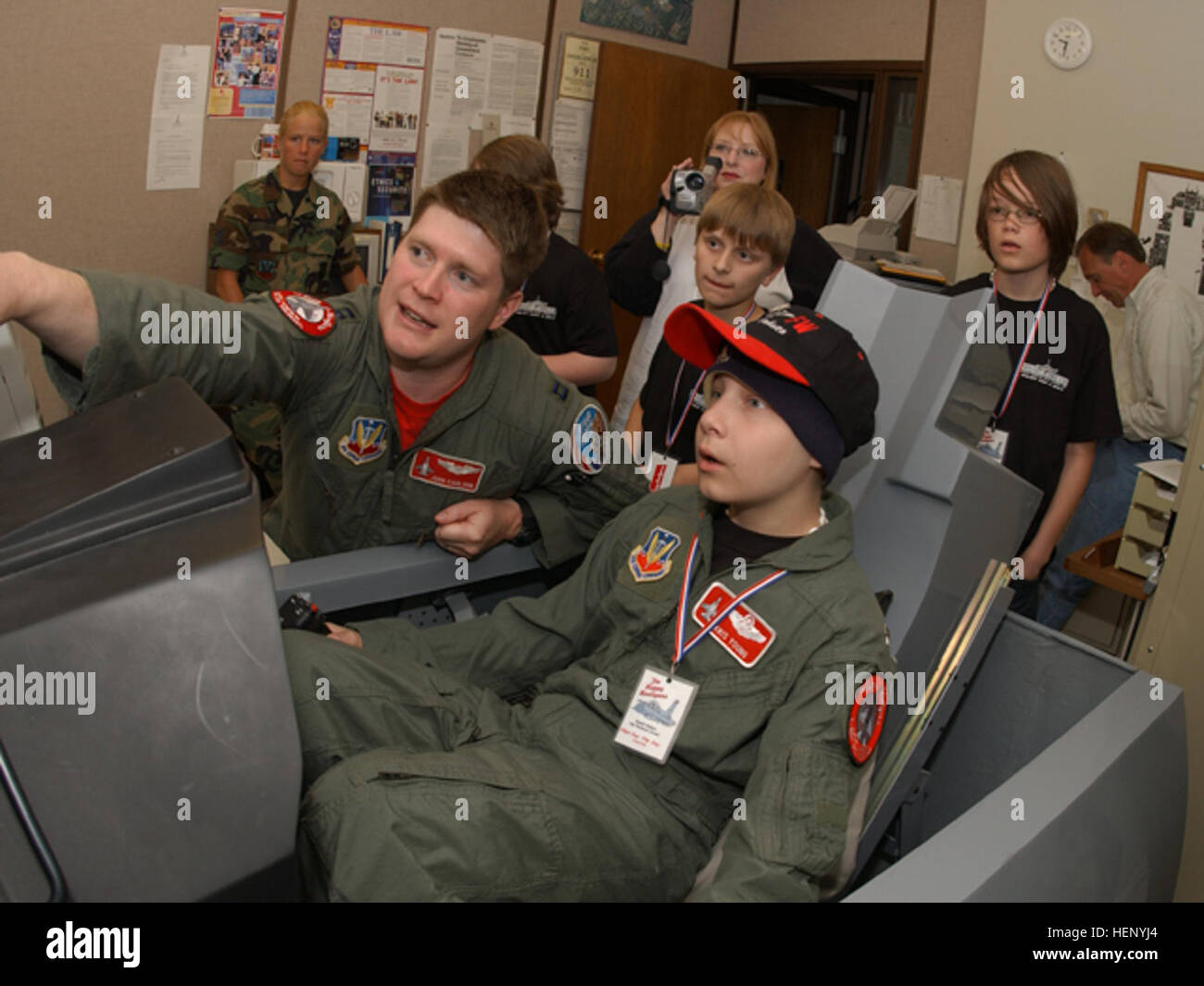 A 178th Fighter Squadron pilot guides a guest operating an F-16 flight ...