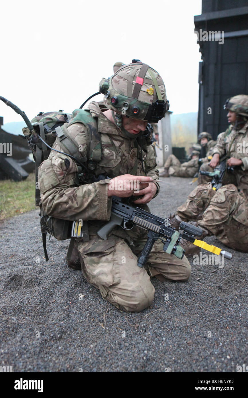 A British cadet of the Royal Military Academy Sandhurst sends up a nine ...