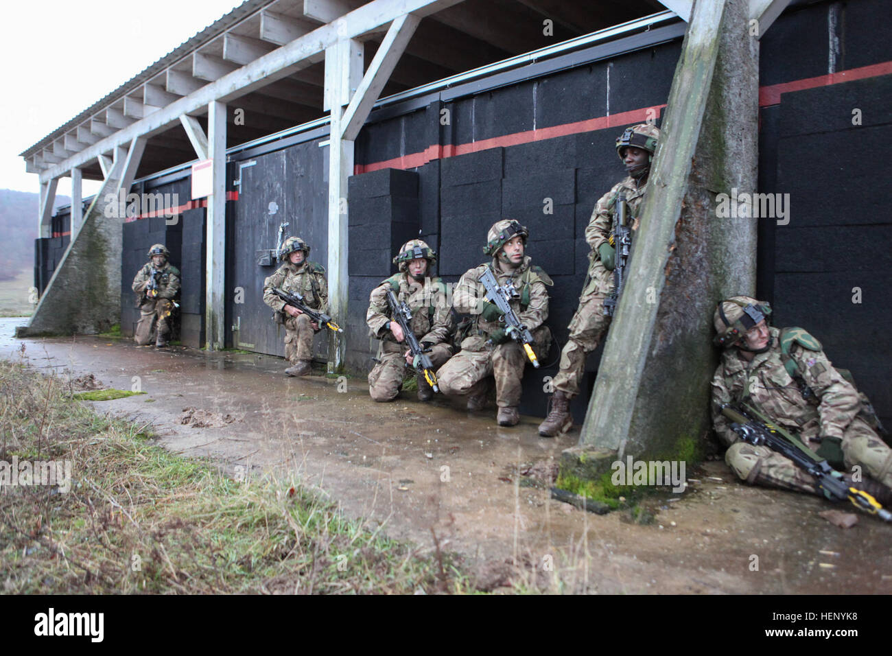 British cadets of the Royal Military Academy Sandhurst stack along a ...