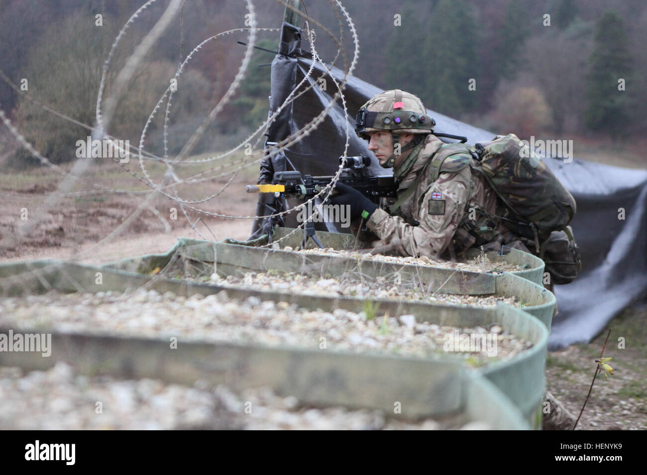 A British cadet of the Royal Military Academy Sandhurst provides ...