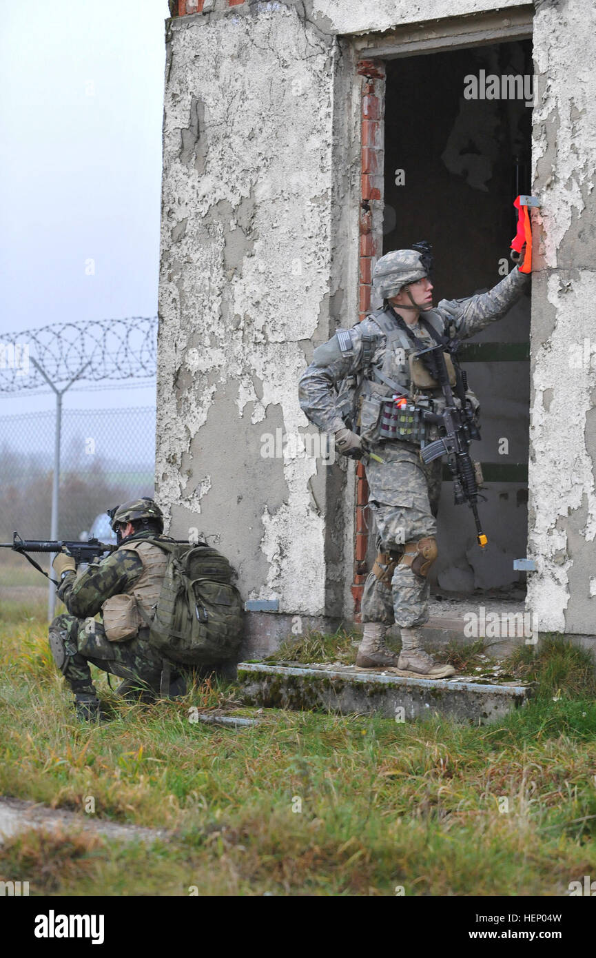 A U.S. paratrooper (right), assigned to 1st Squadron, 91st Cavalry ...