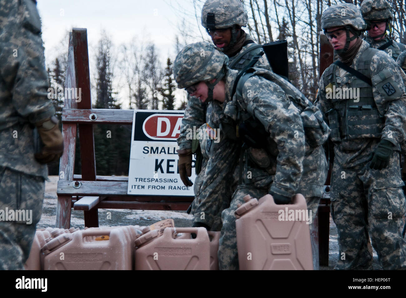 Soldiers with U.S. Army Alaska carry water cans during the USARAK Small ...