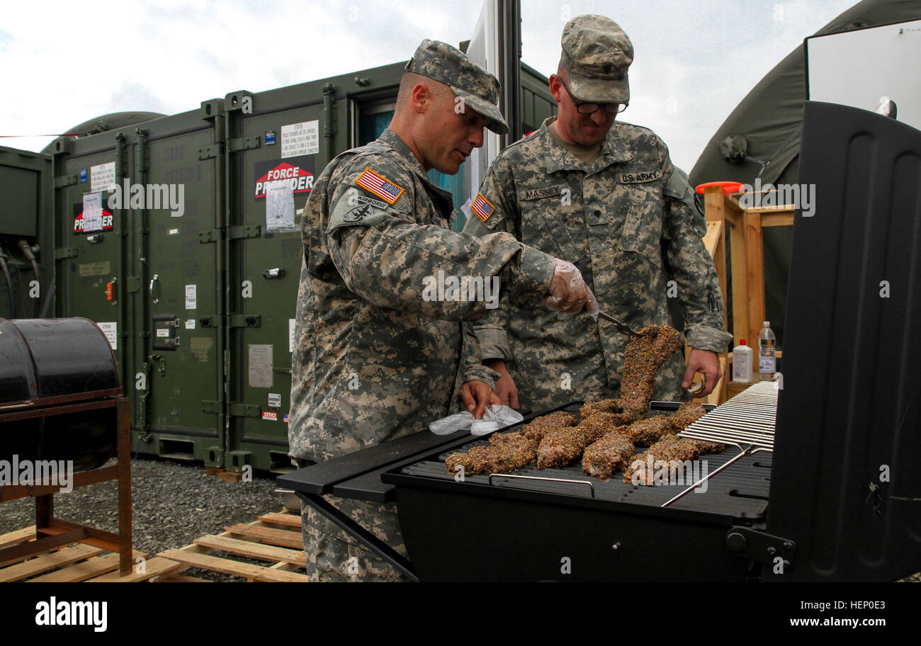 Sgt. Steven Jordan, left, chef leader, and Spc. Christopher Massey ...