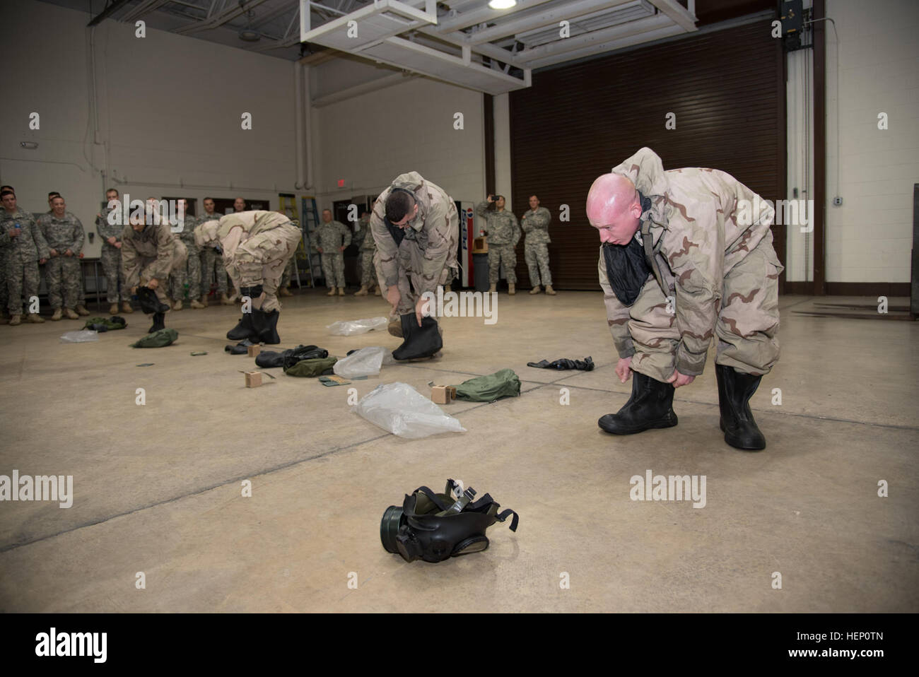 Soldiers of the 153rd Military Police Company conduct chemical gas mask ...