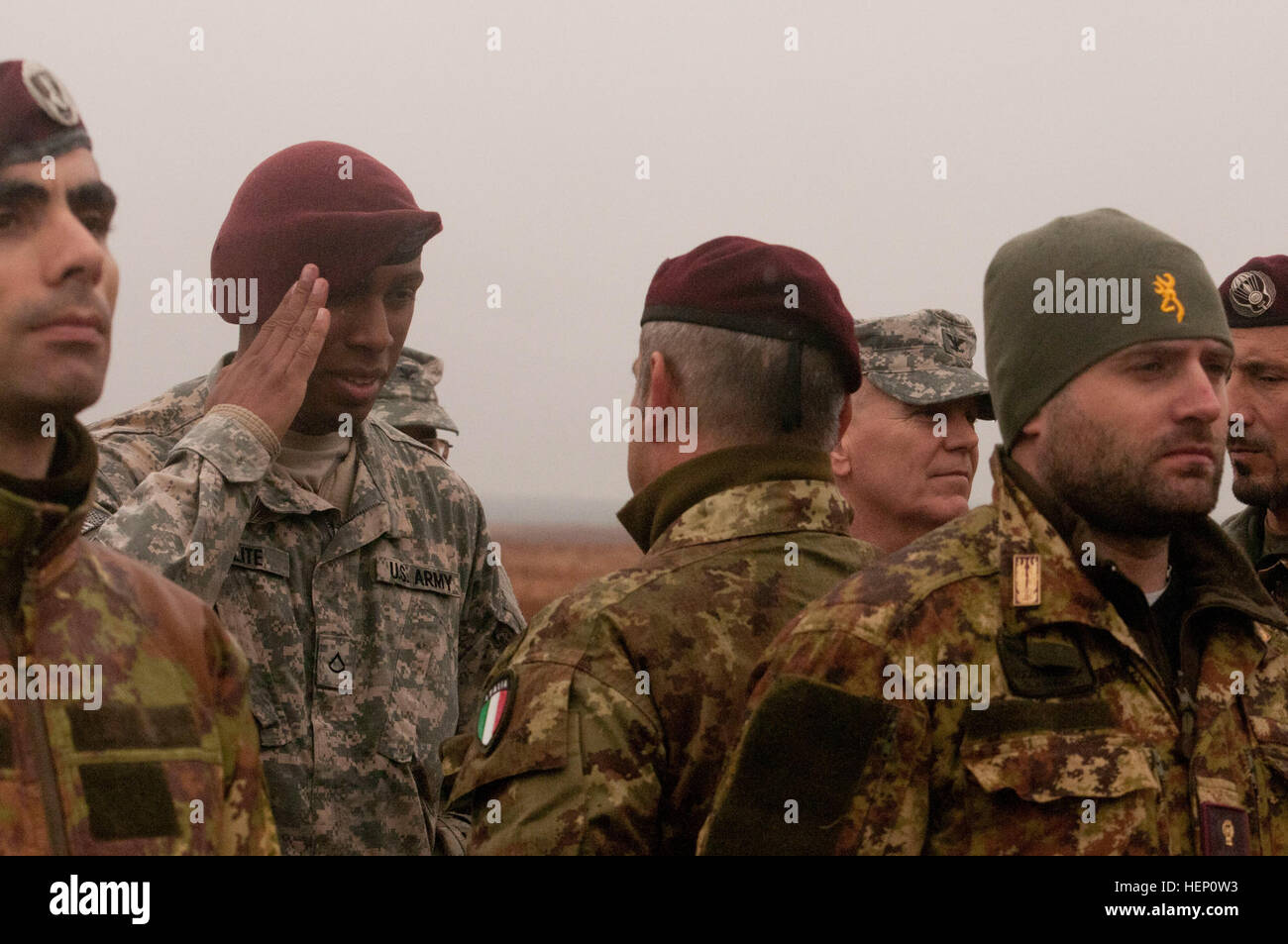 Pfc. Ezekiel Polite of the 82nd Airborne Division salutes an Italian ...