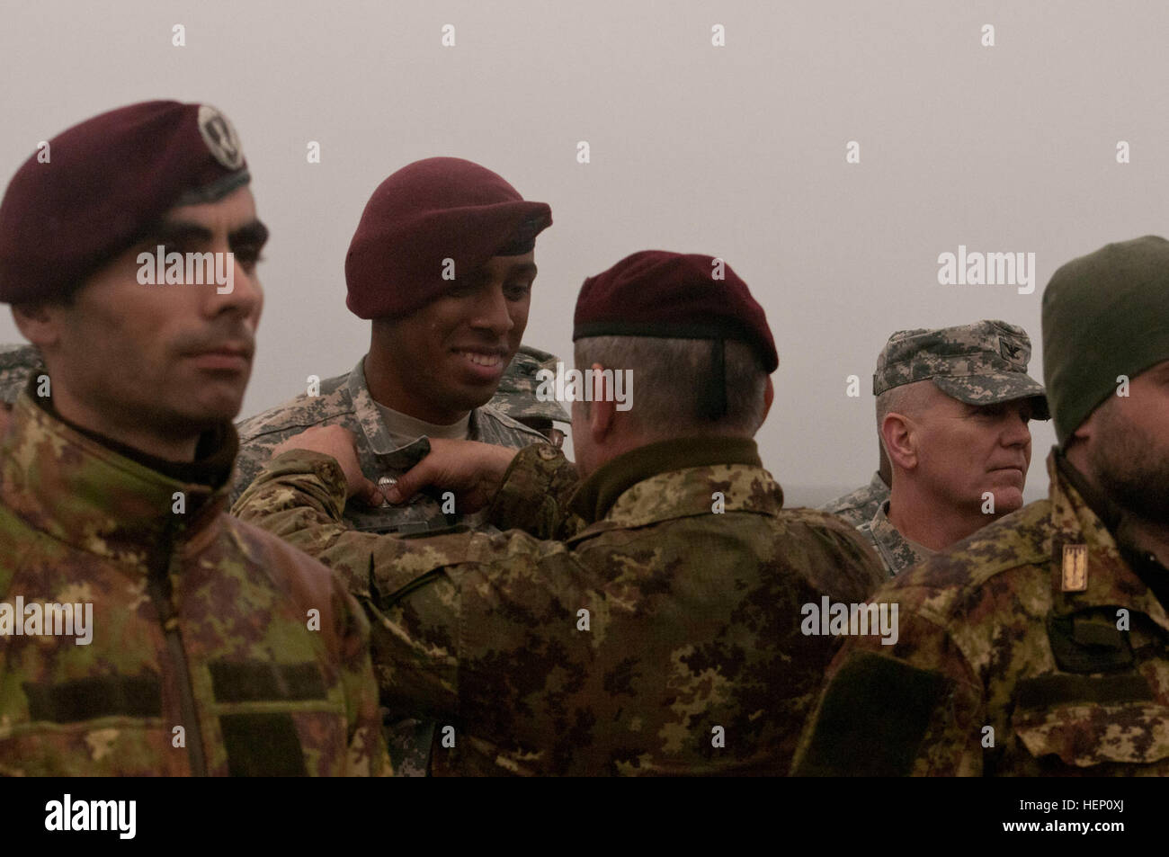 Pfc. Ezekiel Polite of the 82nd Airborne Division receives his foreign ...