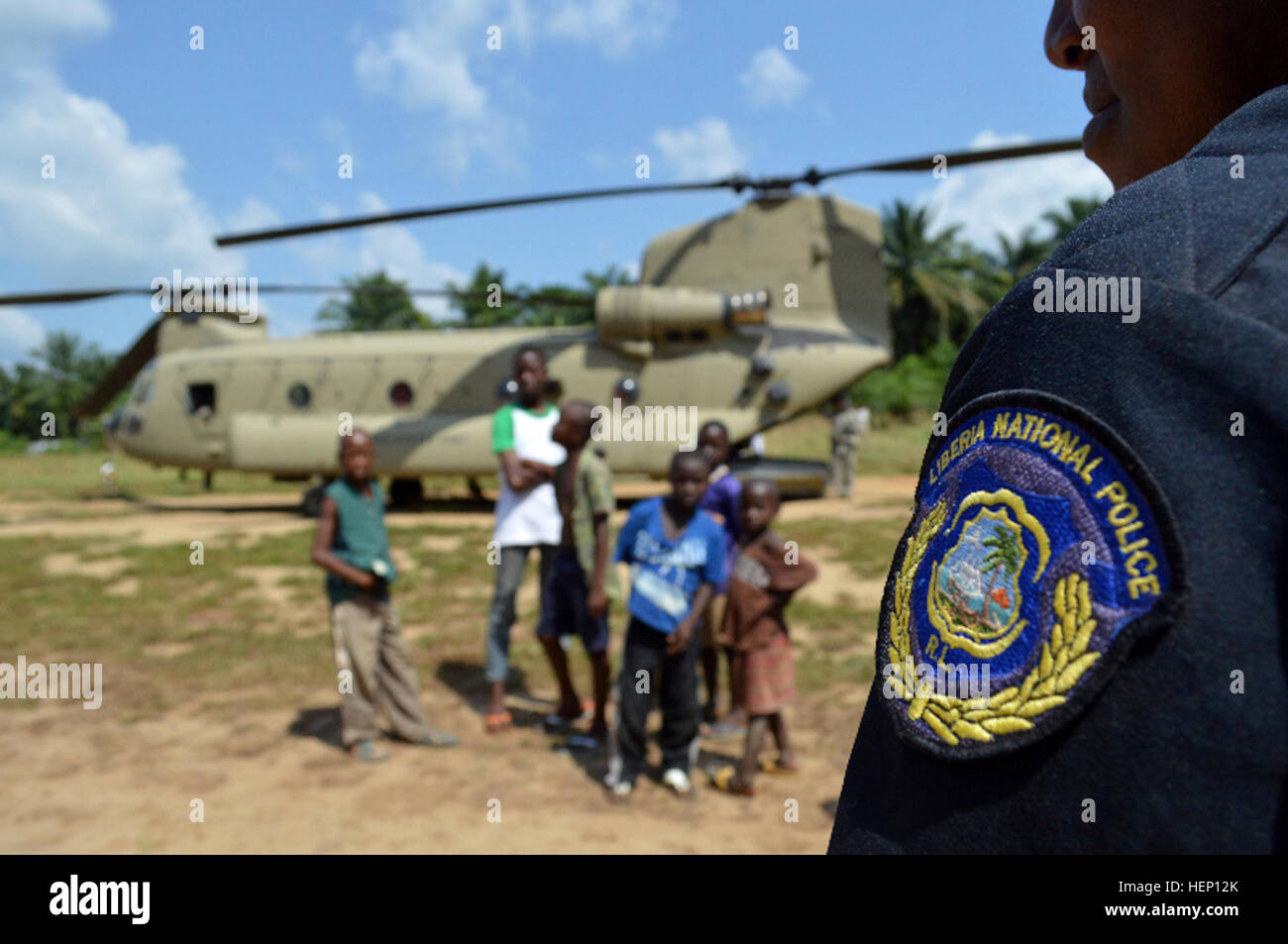 Members from the Liberian National Police provide crowd control while U ...