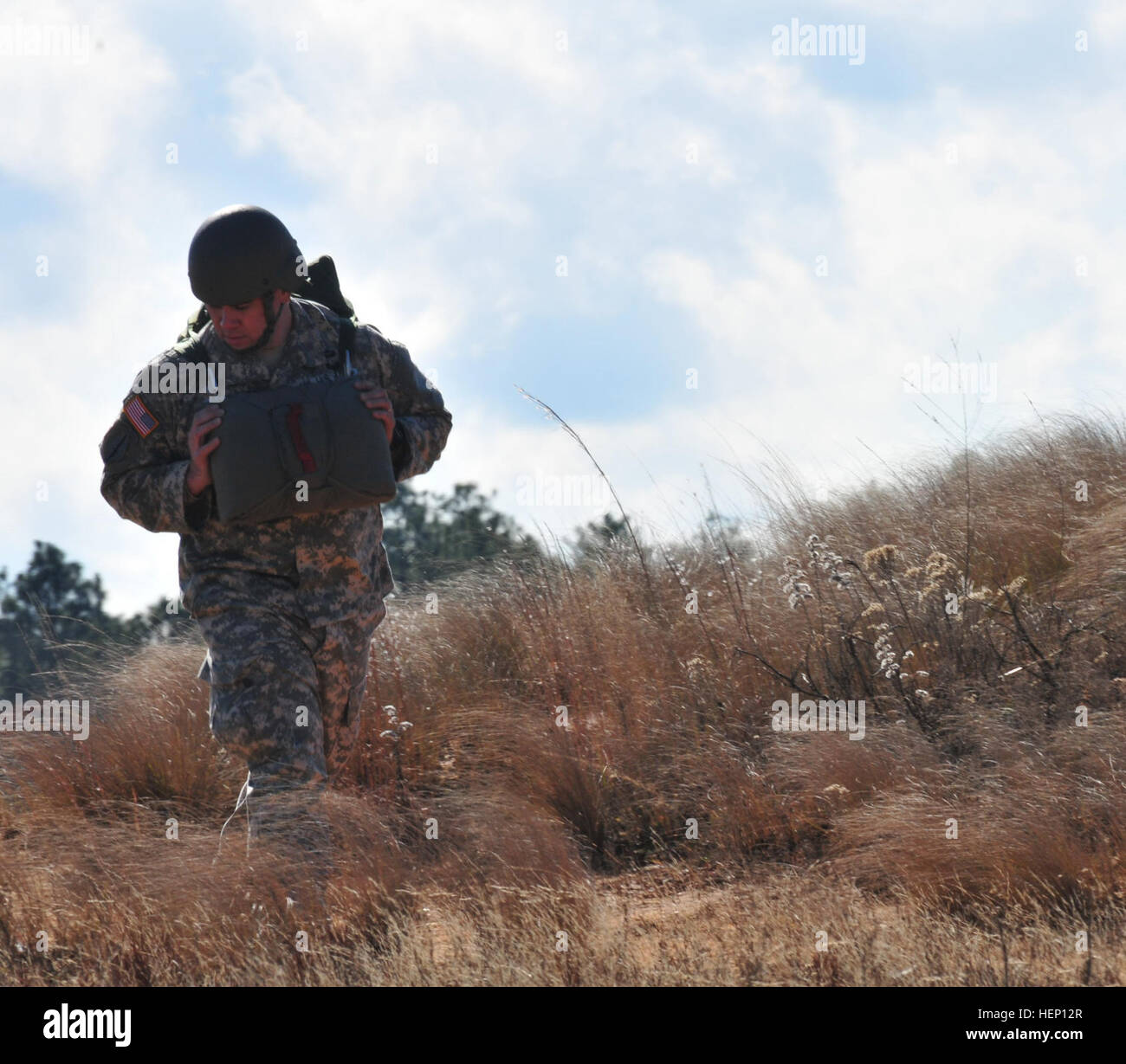 A U.S. Army paratrooper moves to the rally point after landing at Luzon ...