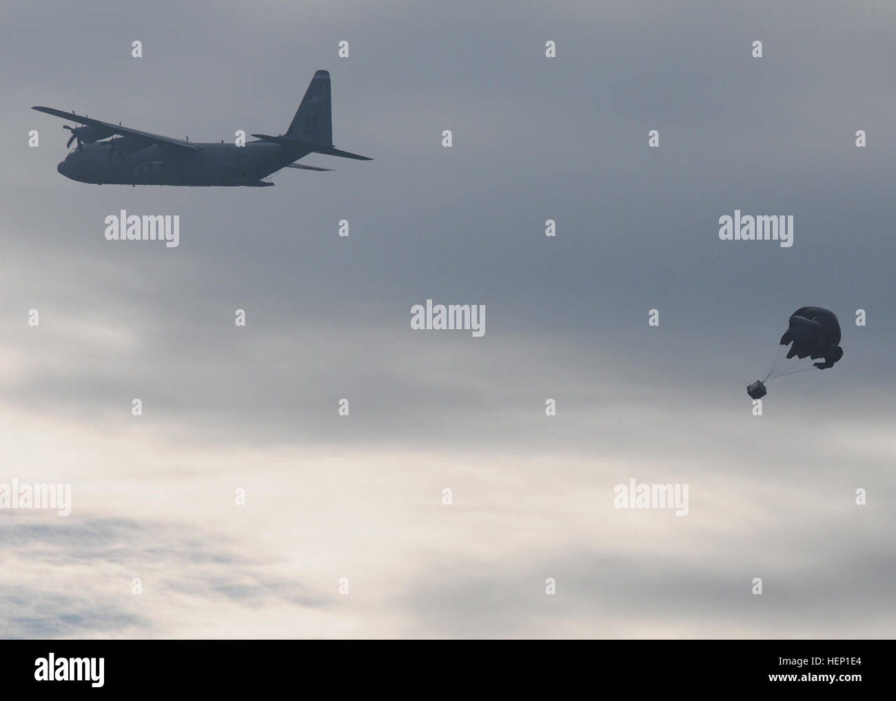 A C-17 Hercules aircraft from Ramstein Air Base, Germany, drops a cargo ...