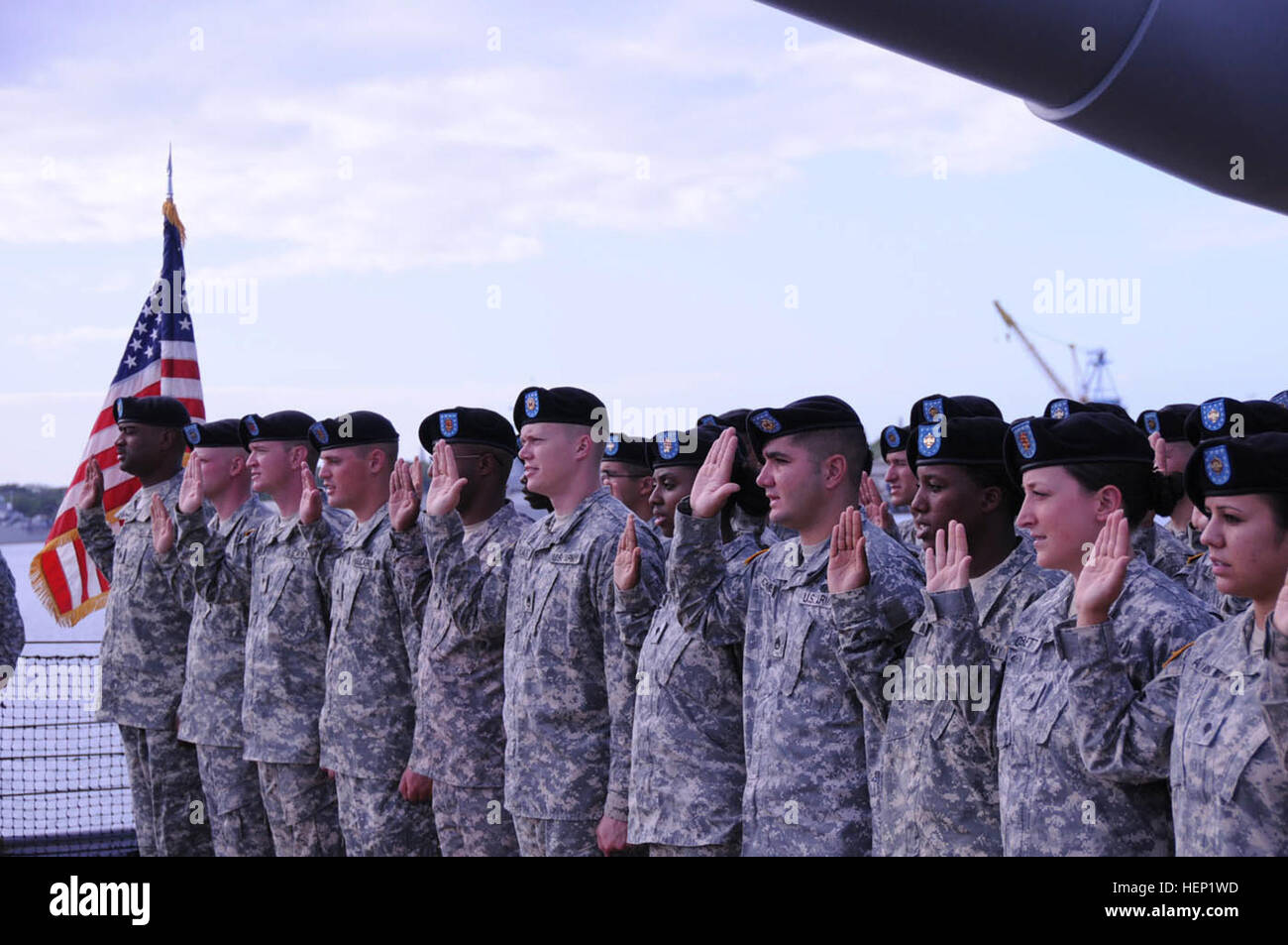 Soldiers raise their right hand and take the Oath of Enlistment during ...