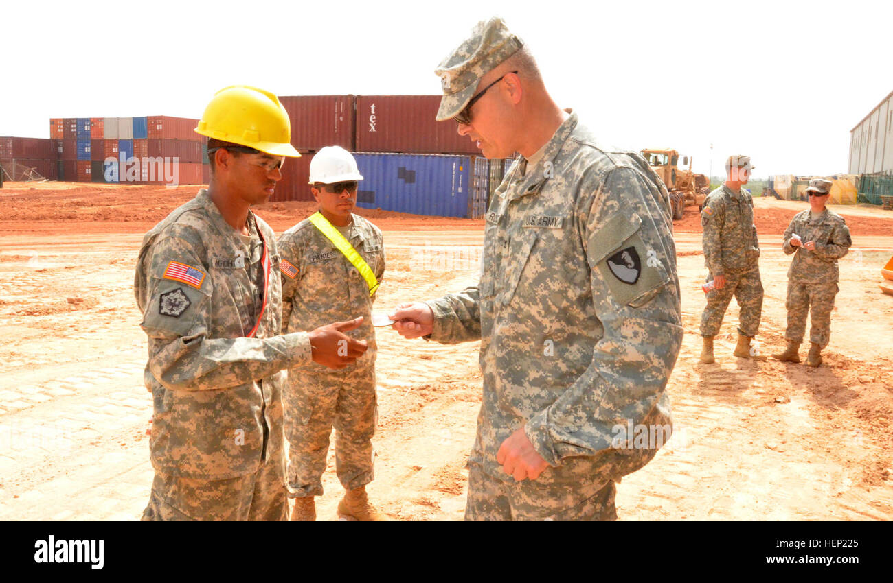 Spc. Sterling Wright, left, of Summerville, S.C., a heavy equipment ...