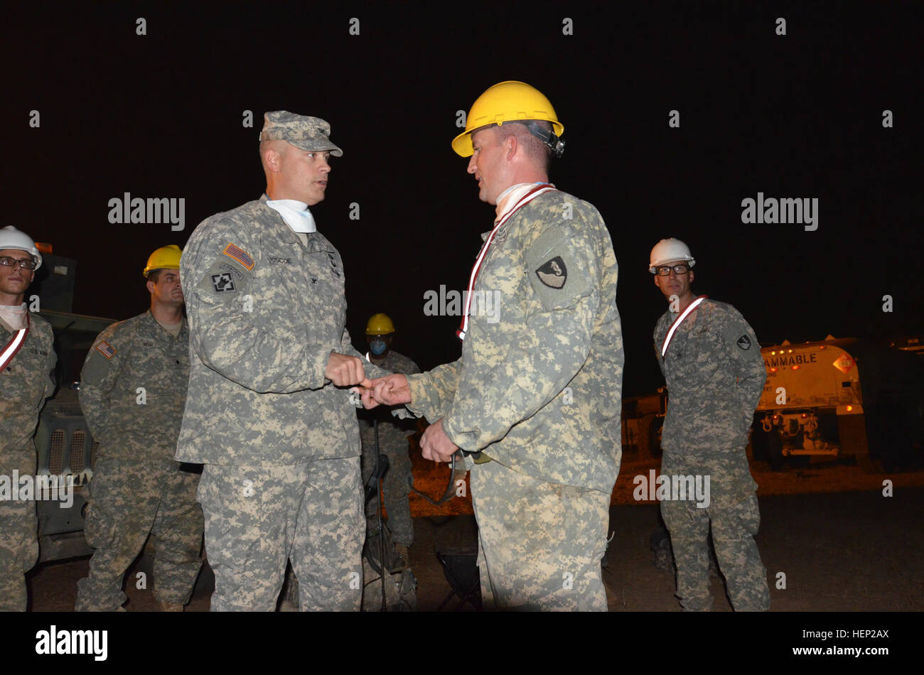 Col. Heath Roscoe, left, commander of the 36th Engineer Brigade out of ...