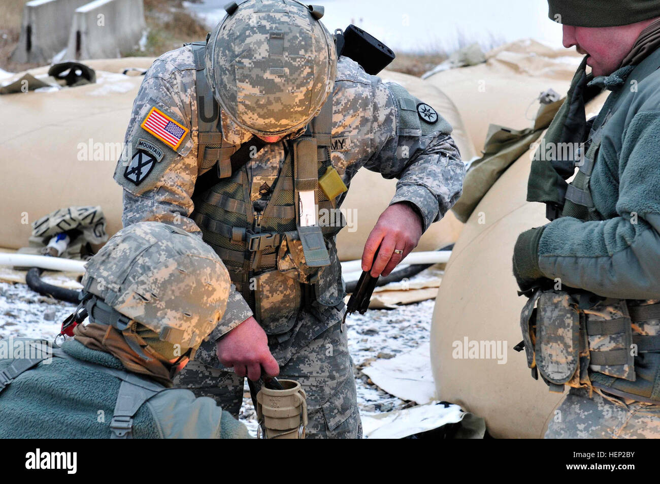 Soldiers from the 326th Quartermaster Company prepare water pumps and ...