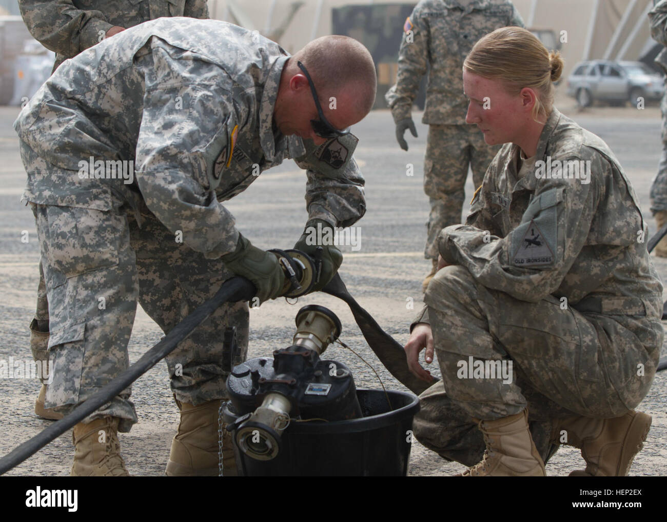 Spc. Danielle Taylor, right, a flight engineer and a fuel handler ...