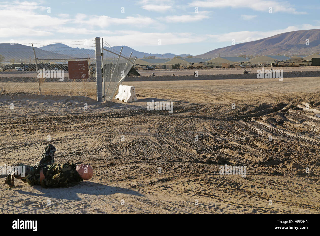 A casualty with a simulated improvised explosive device attached, lies ...