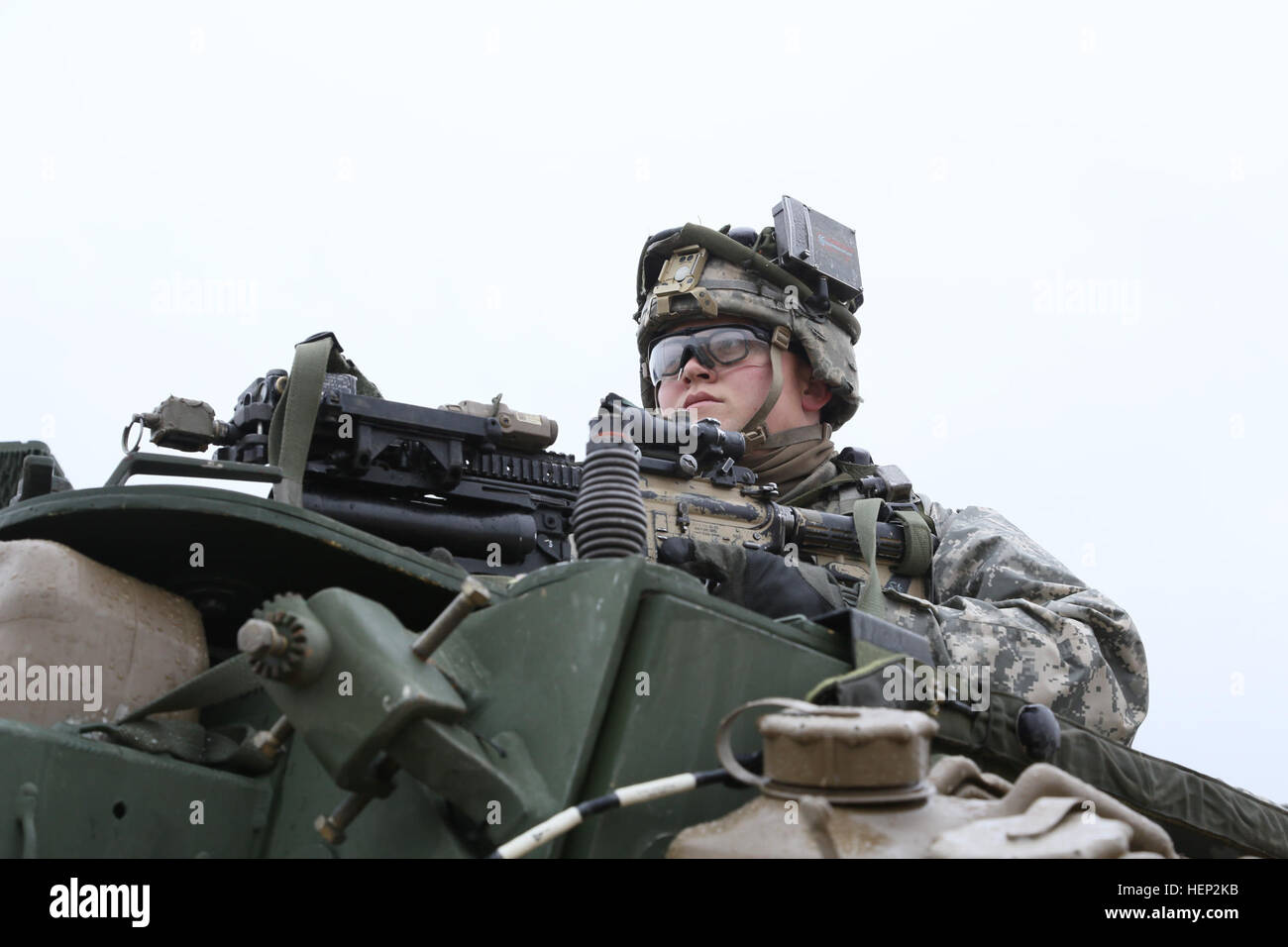 A U.S. Soldier of 1st Squadron, 2nd Cavalry Regiment scans his sector ...