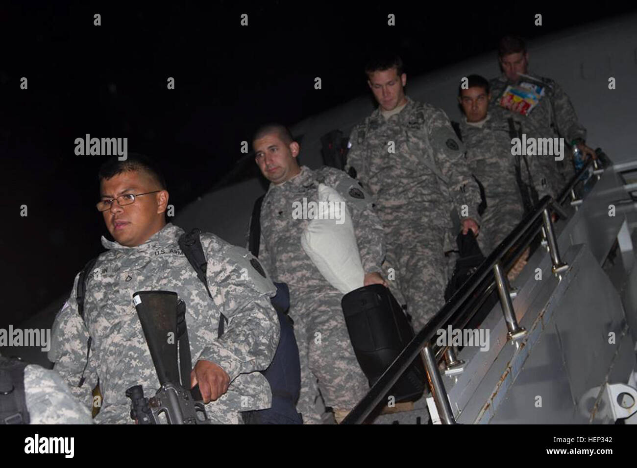 Soldiers from the 2nd Squadron, 6th Cavalry Regiment step off a plane ...