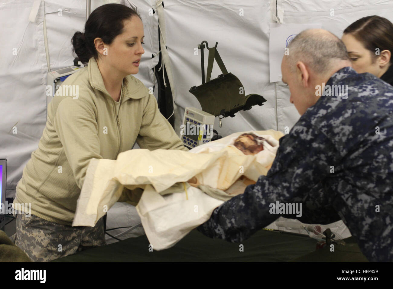 Capt. Kimberly Middleton, 75th Combat Support Hospital, transfers a ...